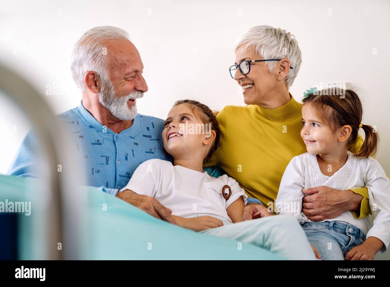 Happy children having fun and love with their grandparents together ...