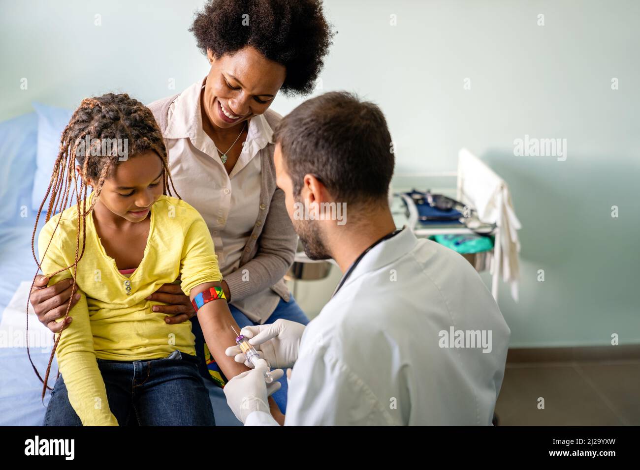 Pediatrician takes blood from a child patient. Healthcare antibody test ...