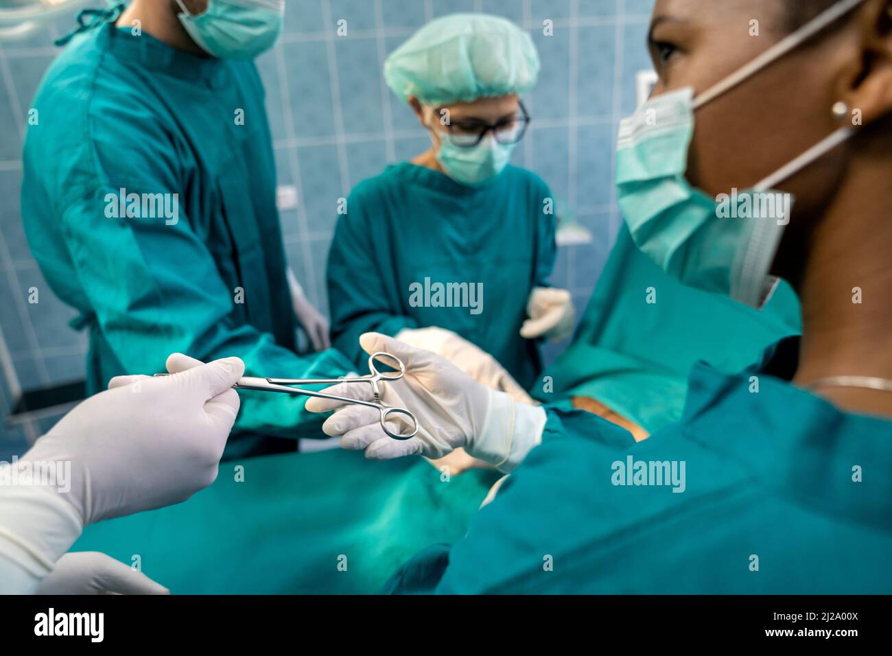 Team of surgeon at work in operating room. Healthcare, hospital concept ...