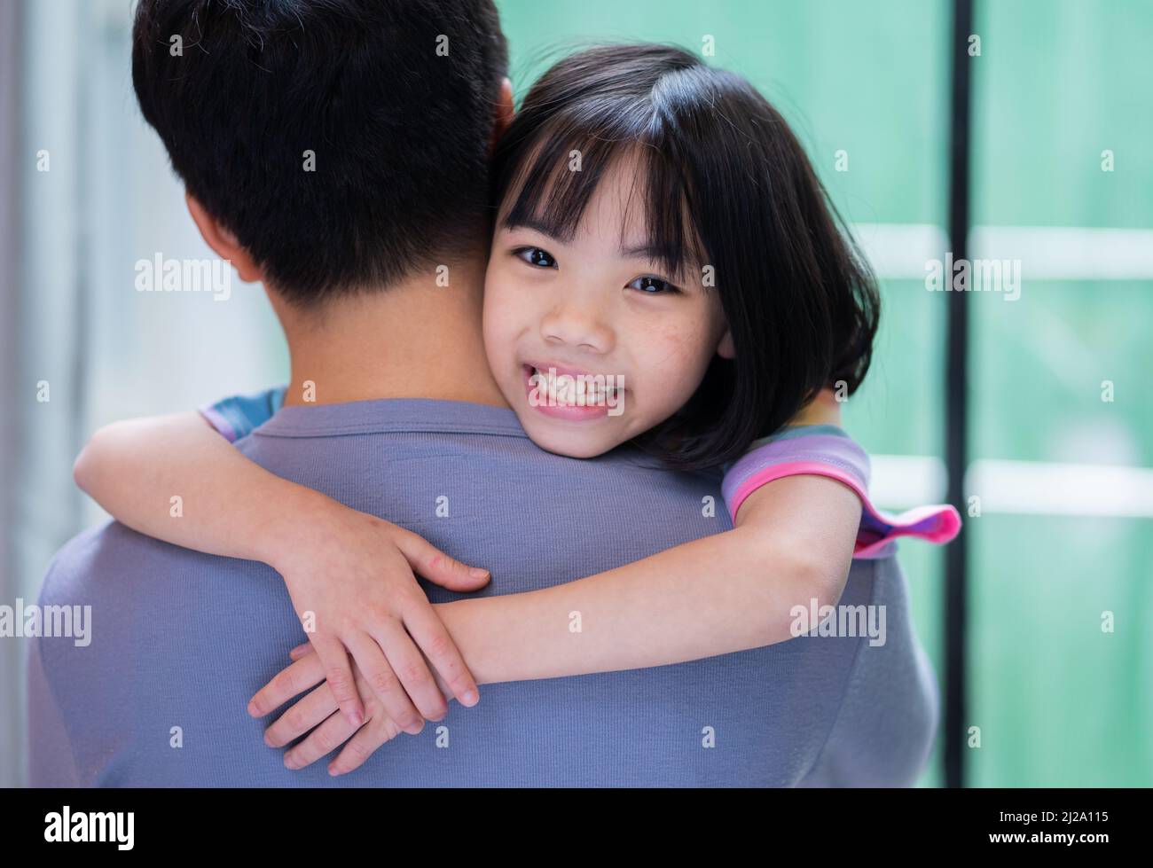 Asian father and daughter at home Stock Photo - Alamy