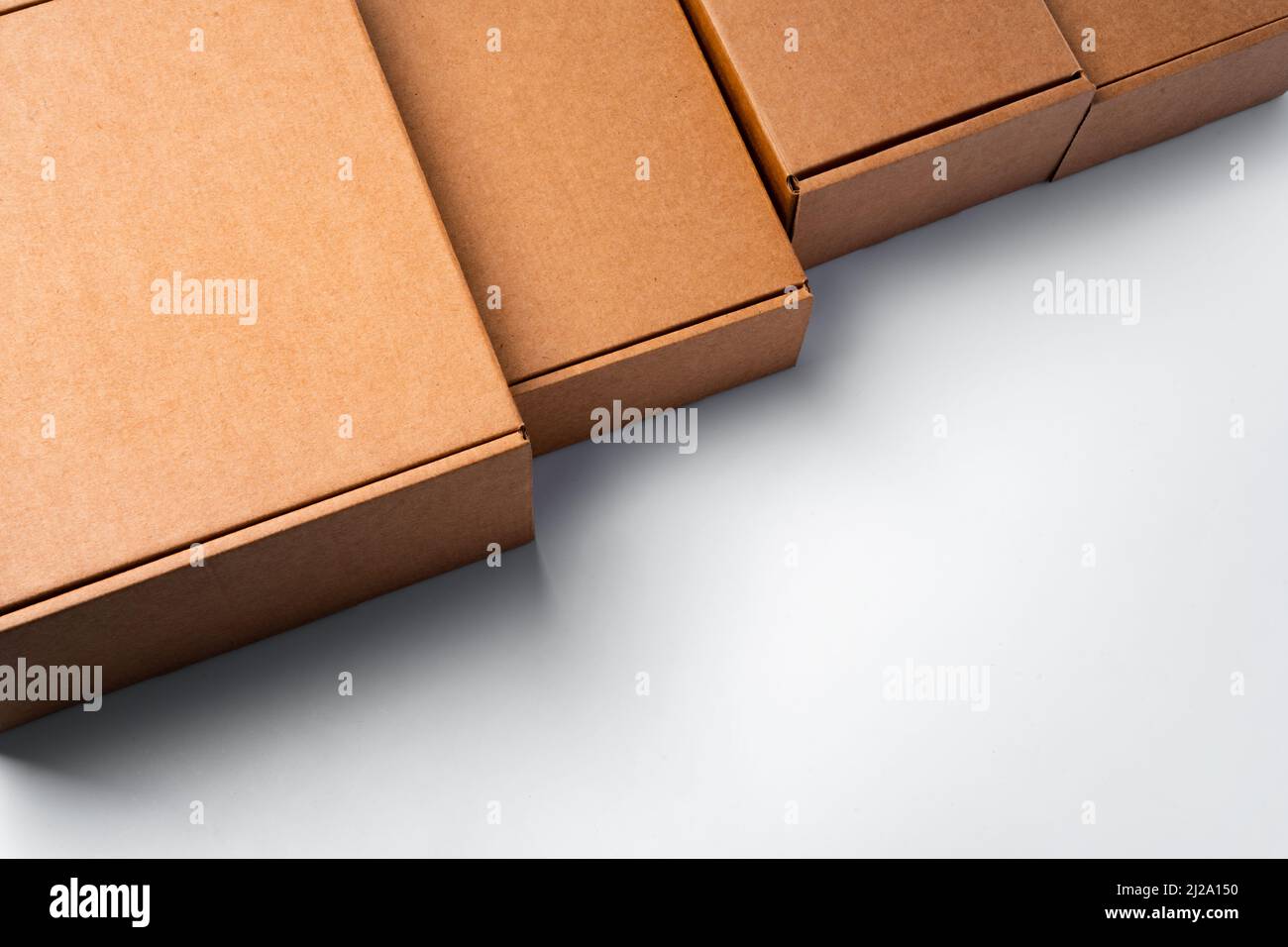 Lot of cardboard boxes on white background Stock Photo - Alamy