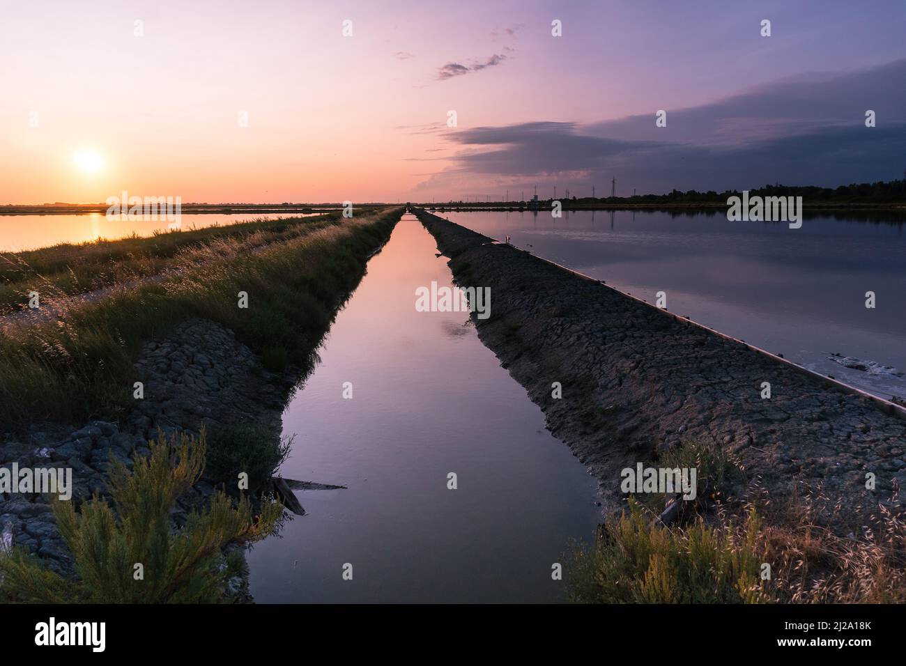 Walk through the famous saltern of Cervia-Italy during the evening ...