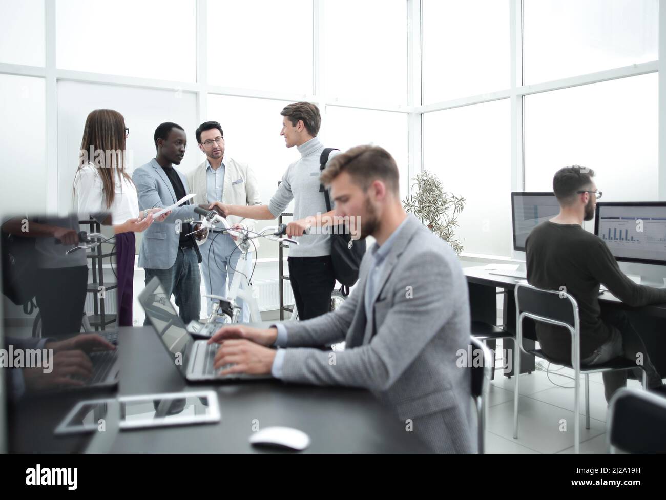 employees working on computers in the office Stock Photo - Alamy