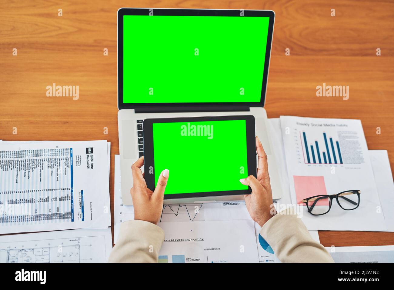 Working on different devices to get the work done. Cropped shot of an ...