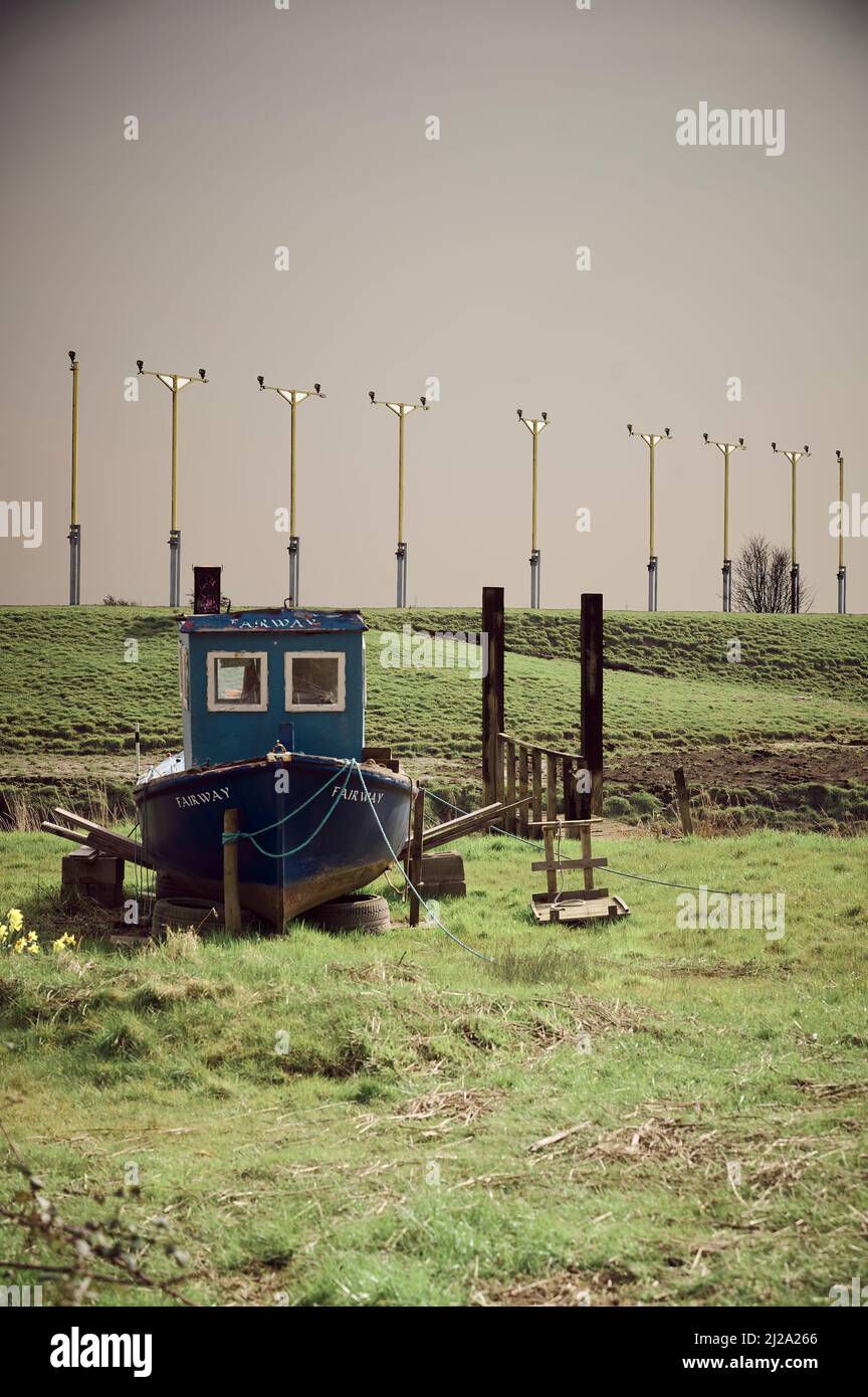 Small boat and landing lights at end of runway Stock Photo - Alamy