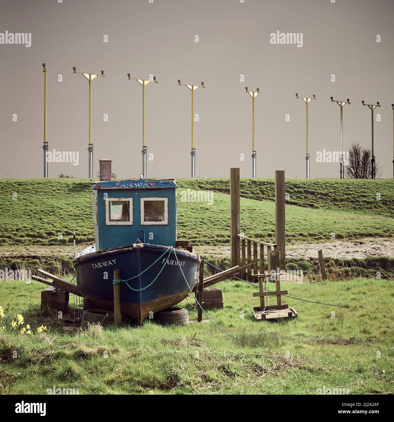 Small boat and landing lights at end of runway Stock Photo - Alamy