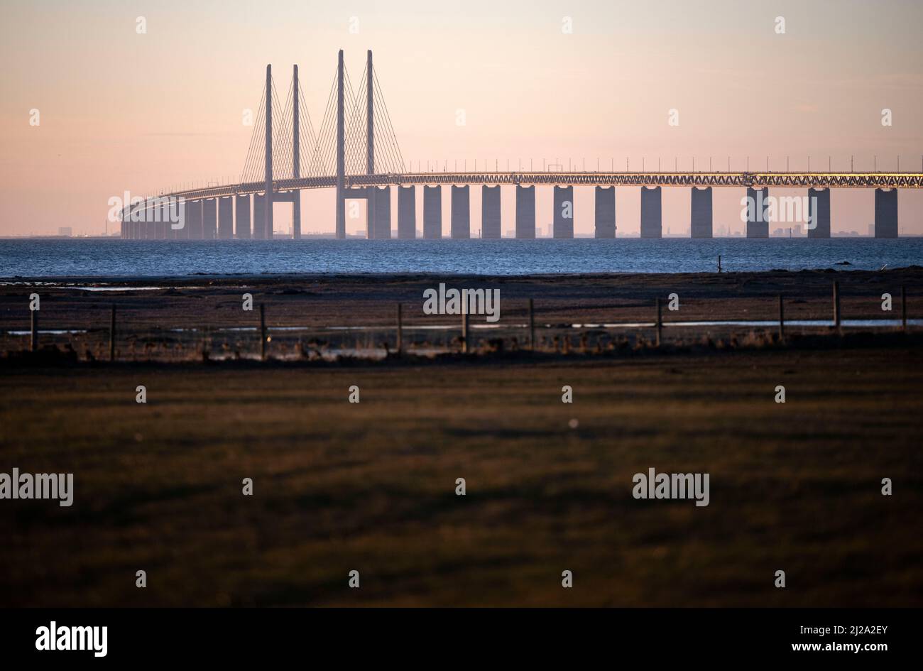 The Oresund Bridge (Swedish: Öresundsbron) at sunset, Malmo, Sweden ...