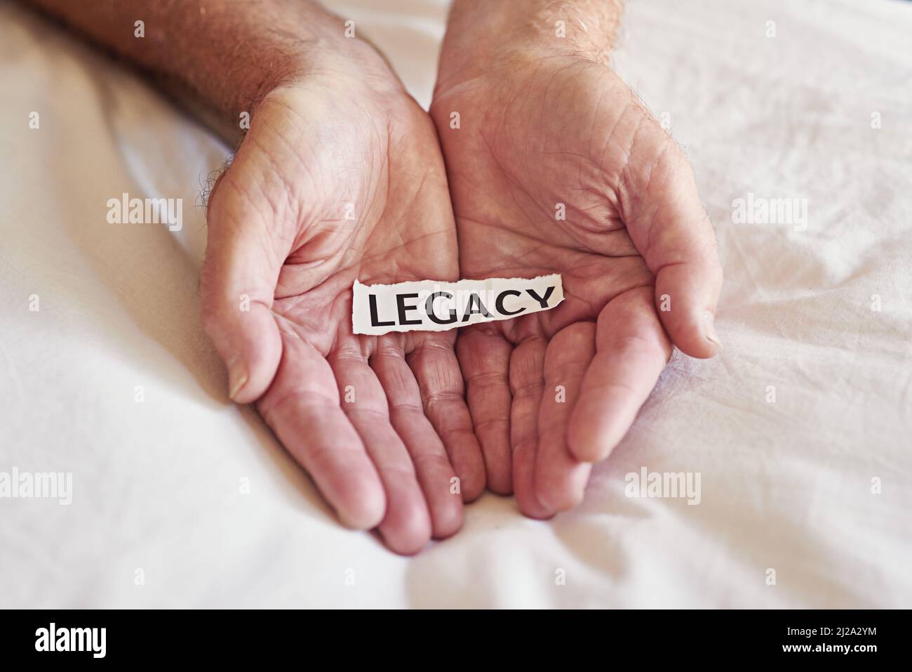 Create a legacy that lasts a lifetime. Cropped shot of a person holding ...