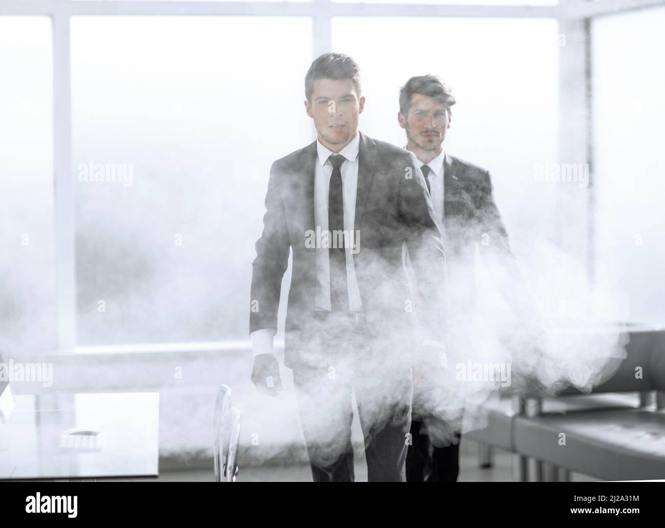 businessmen leave the office in smoke Stock Photo - Alamy
