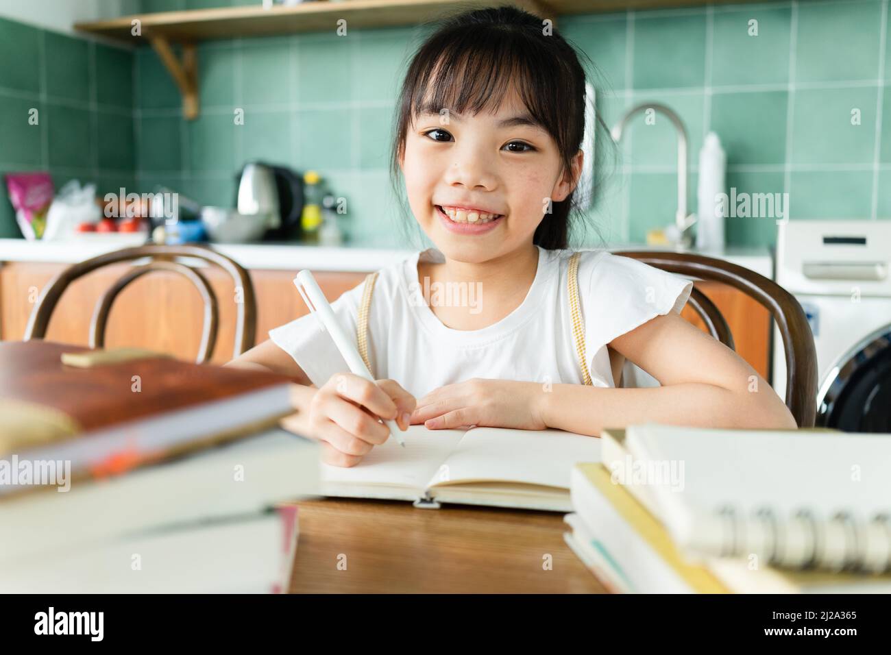 Asian child studying at home Stock Photo - Alamy