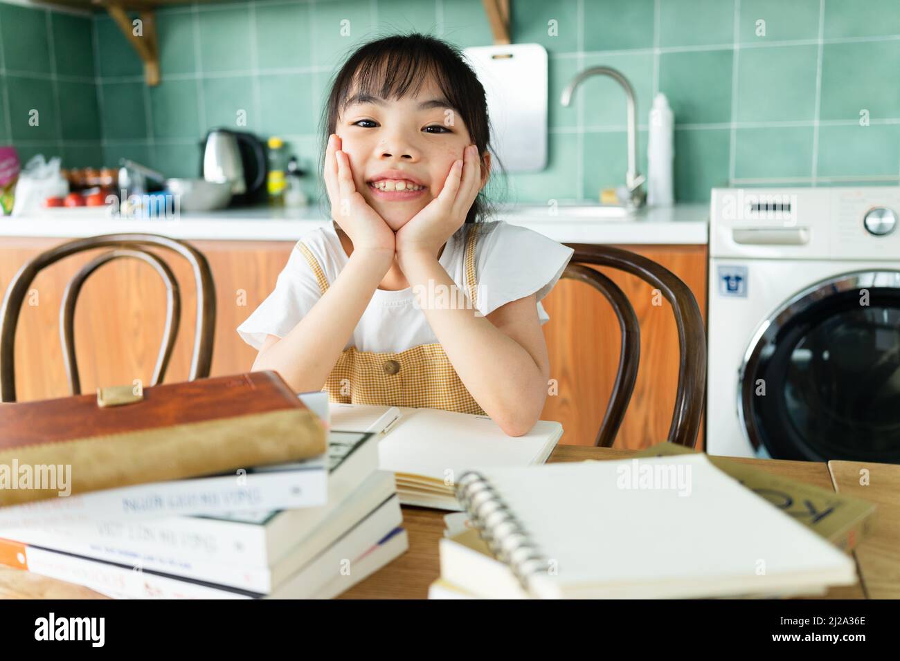 Asian child studying at home Stock Photo - Alamy