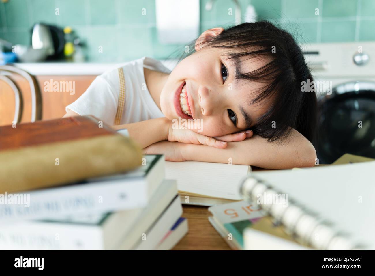 Asian child studying at home Stock Photo - Alamy