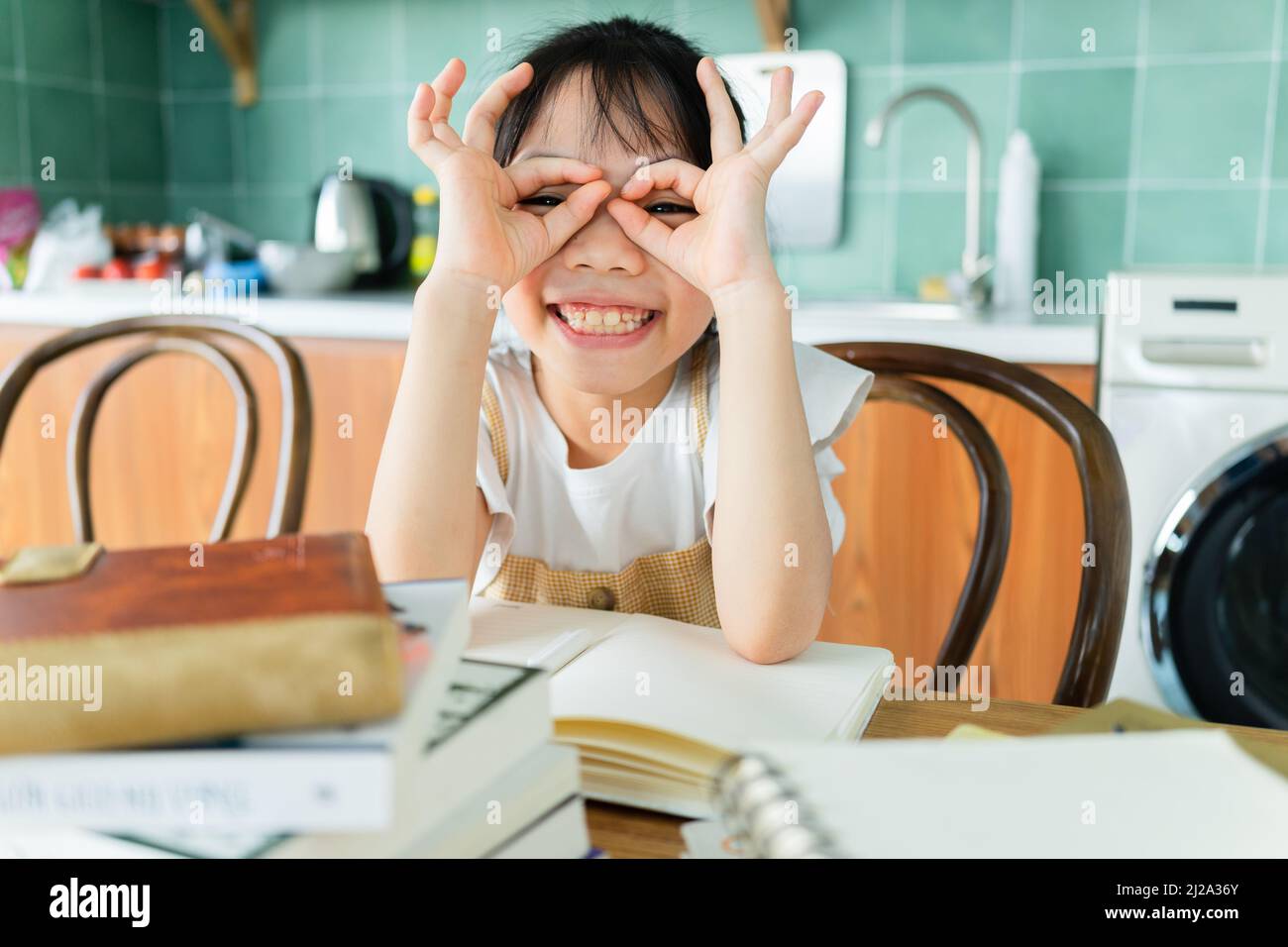 Asian child studying at home Stock Photo - Alamy