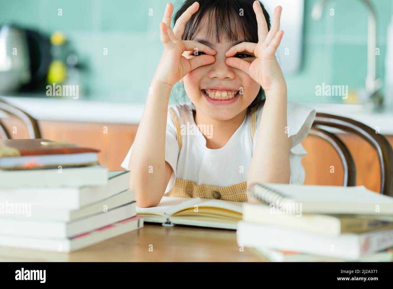 Asian child studying at home Stock Photo - Alamy
