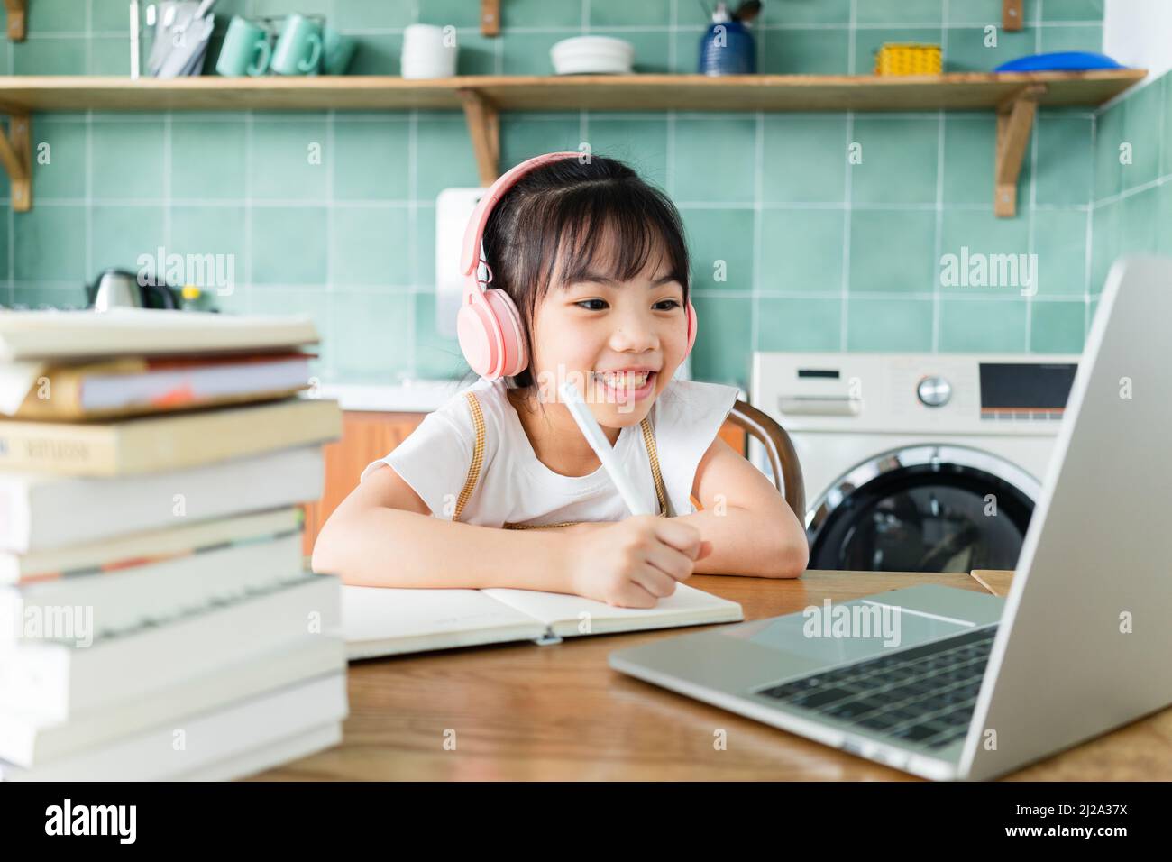 Asian child studying at home Stock Photo - Alamy