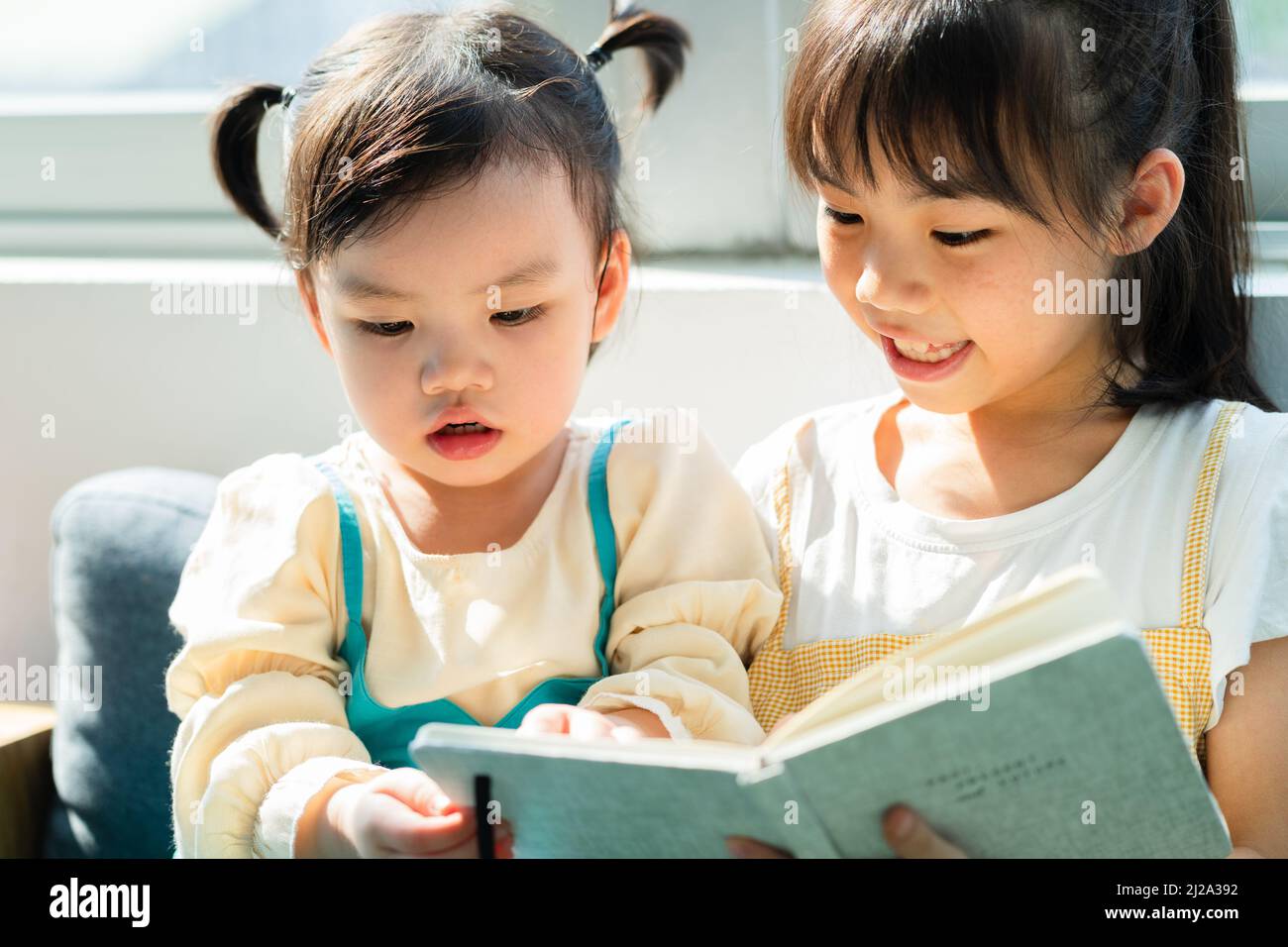 Portrait of two Asian child at home Stock Photo - Alamy