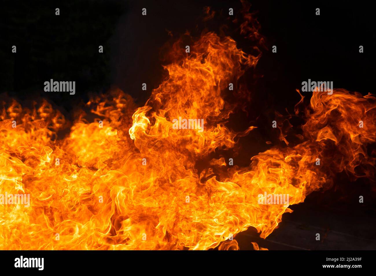 Real hot fire with smoke on the side Stock Photo - Alamy