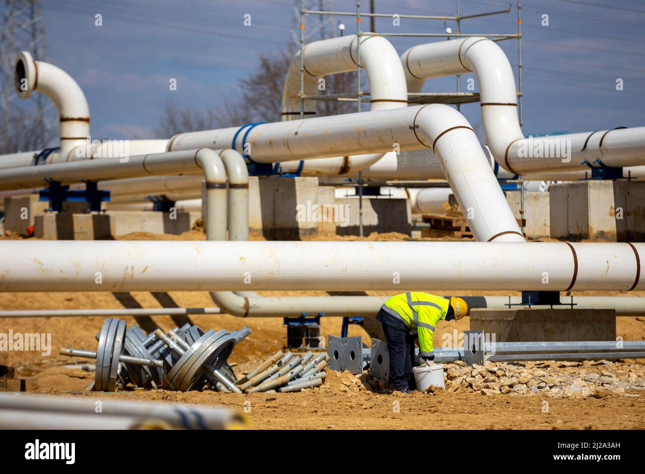 Worker works on a construction site of an interconnected natural gas ...
