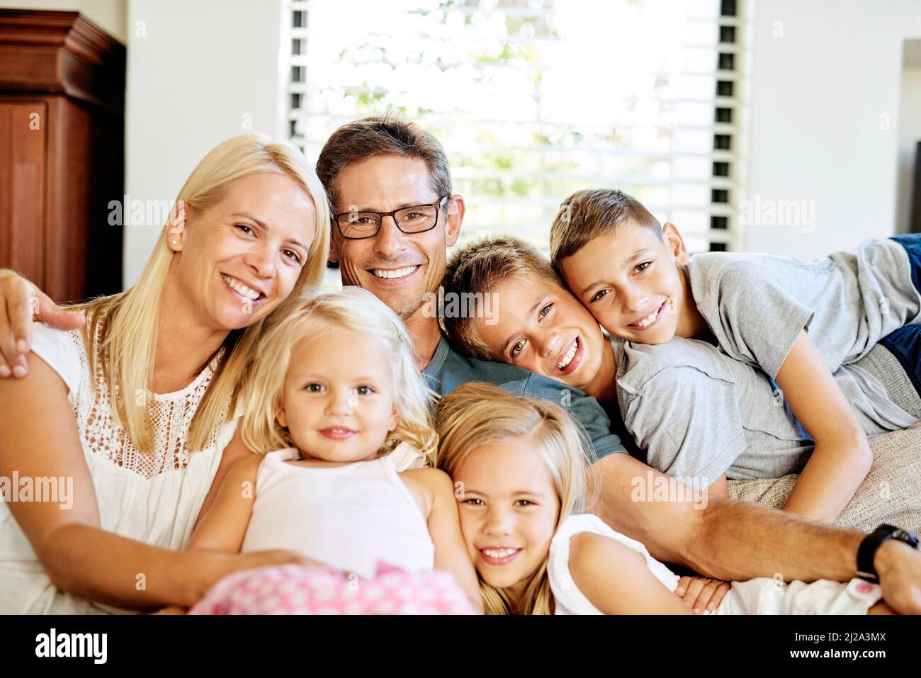 Together is when were happiest. Portrait of a happy family spending ...
