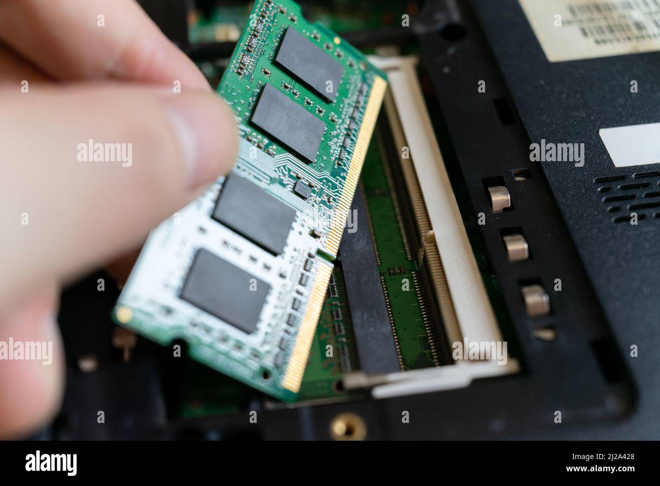 Repairmen are replacing ram for laptop Stock Photo - Alamy Repairmen are replacing ram for laptop Stock Photo - Alamy