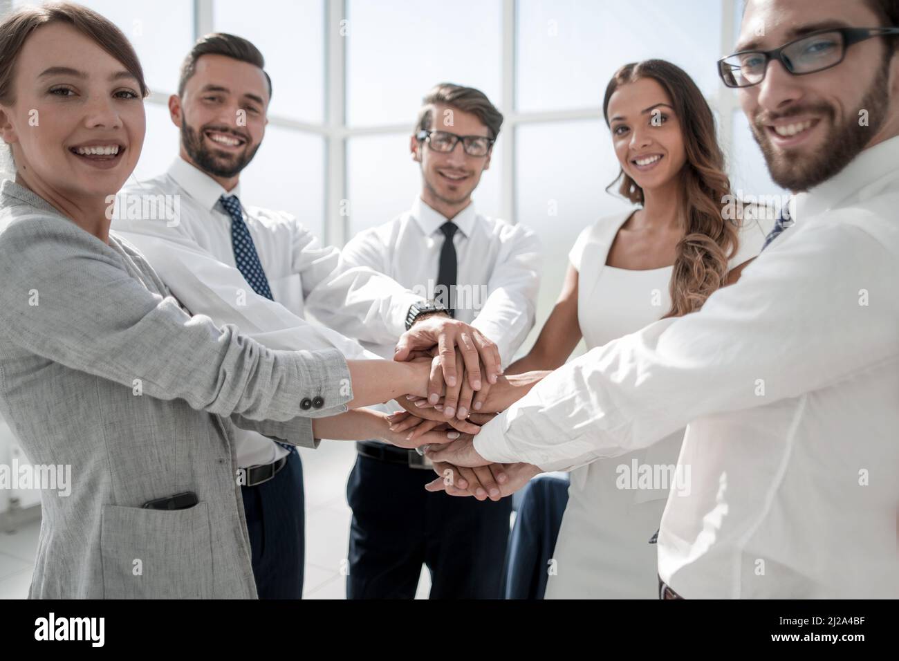business team showing their unity Stock Photo - Alamy