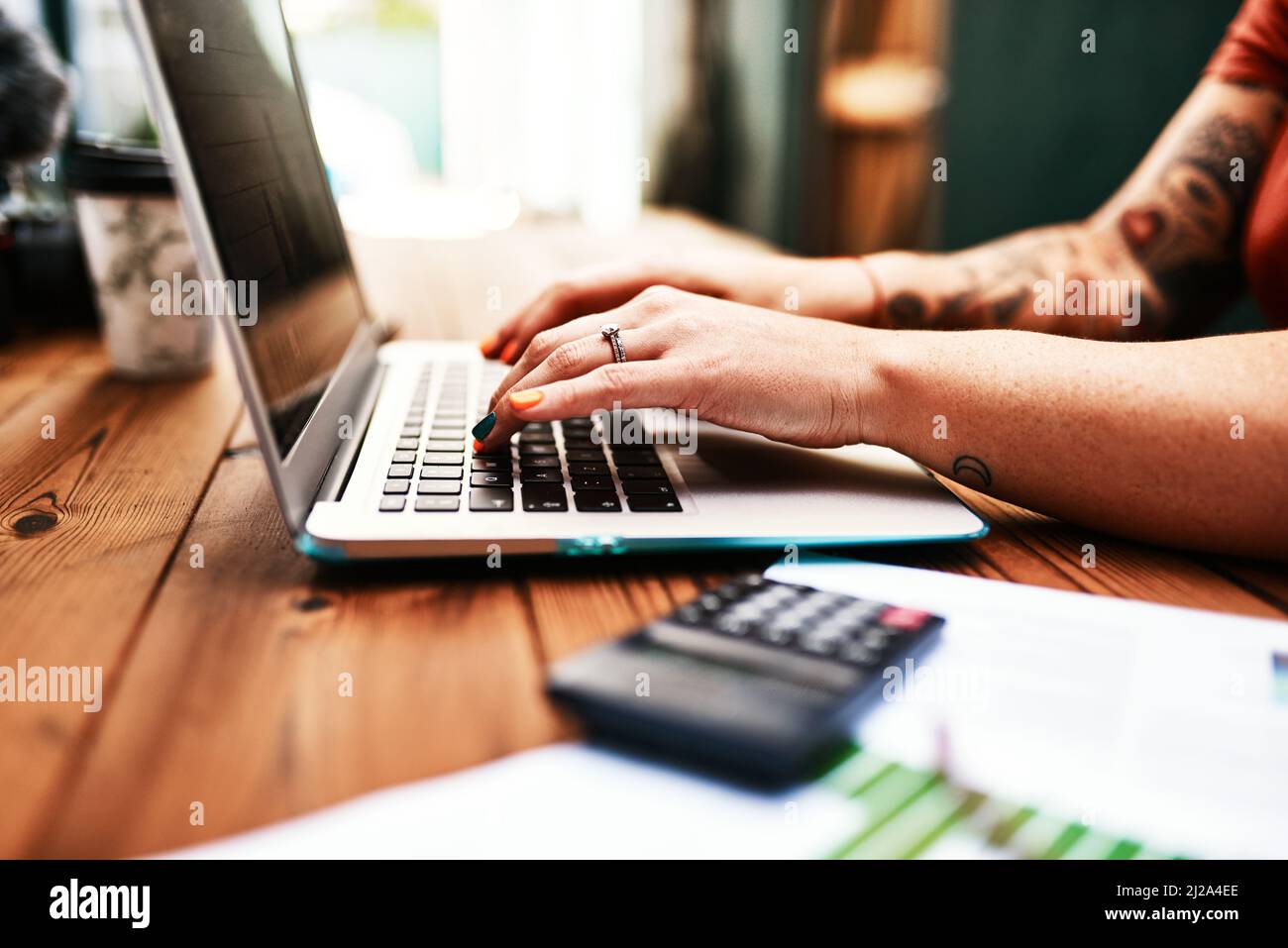 Responding to customer emails. Cropped shot of an unrecognizable ...