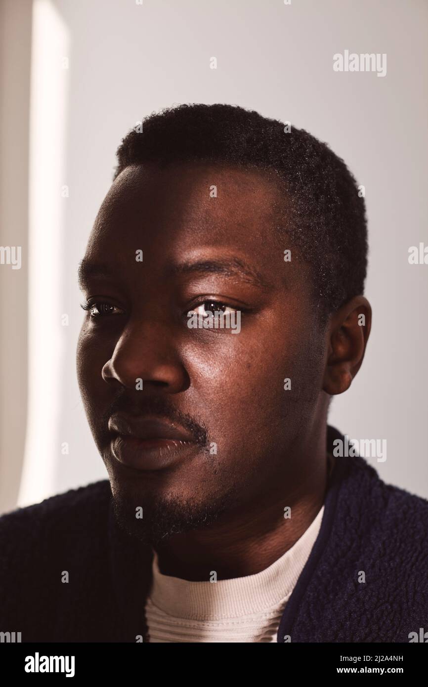 Contemplative man against over white background Stock Photo - Alamy