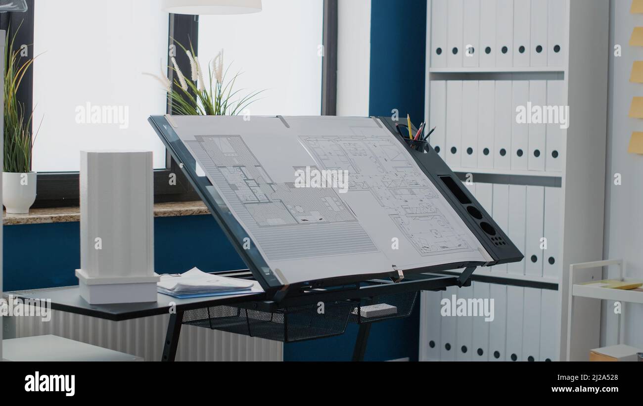 Close up of blueprints plans to design building layout on table in ...