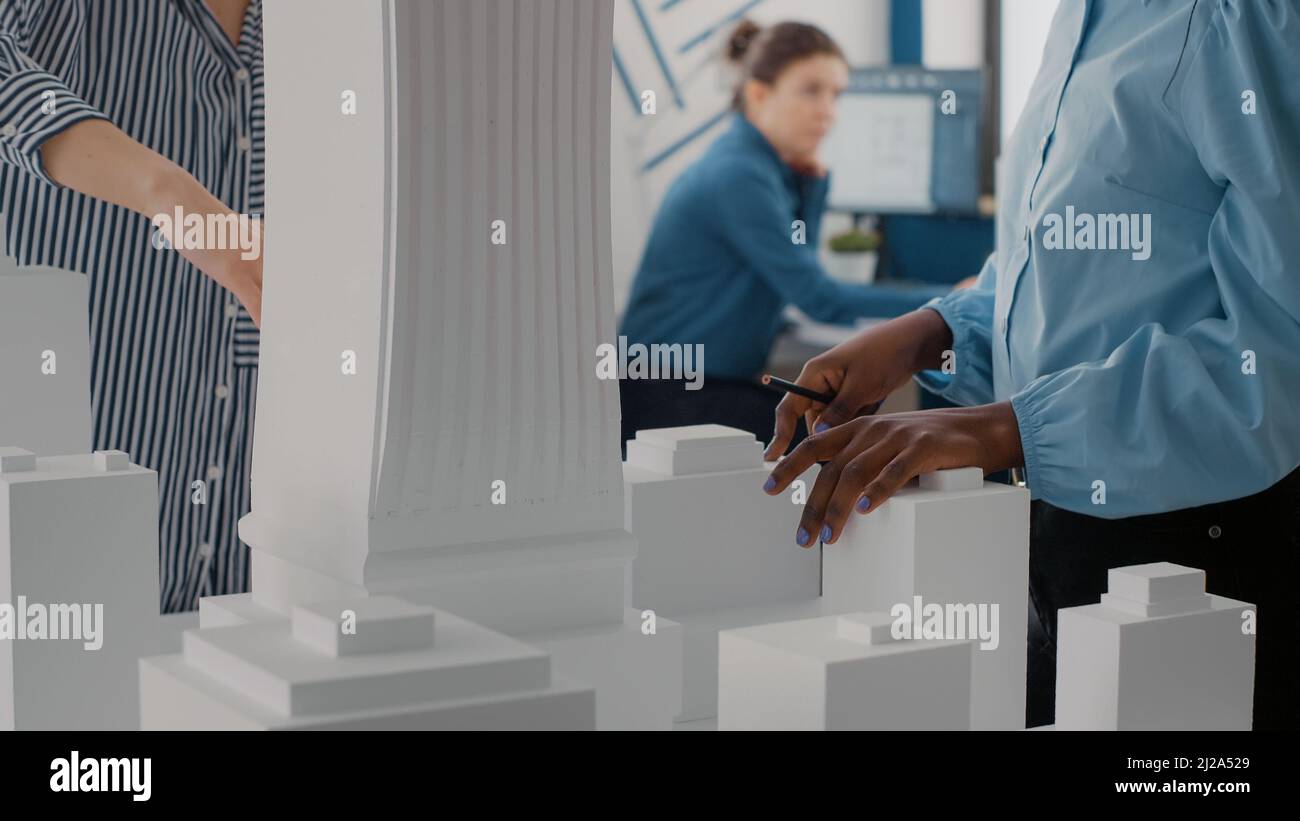 Team coworkers analyzing maquette hi-res stock photography and images ...