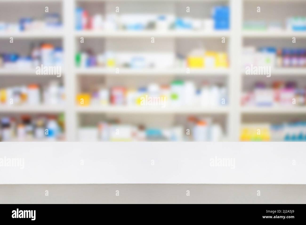 pharmacy counter with blur shelves of drug in the pharmacy drugstore ...