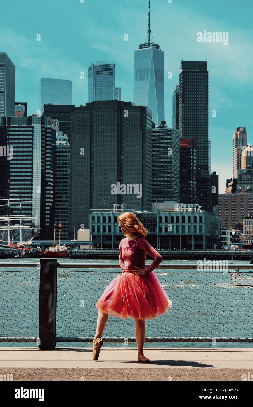 ginger beautiful female model dancing ballet on street, downtown ...