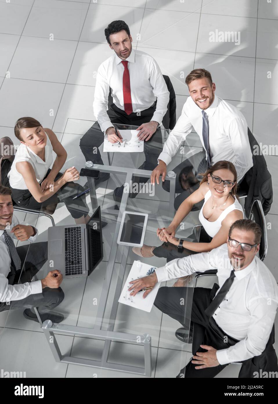 Business People Working Around a Conference Table Stock Photo - Alamy