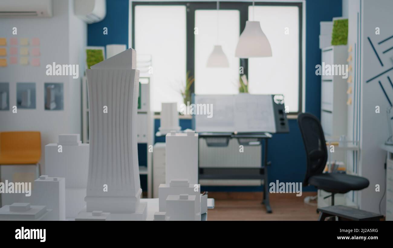 Close up of blueprints plans on design table in empty architectural ...