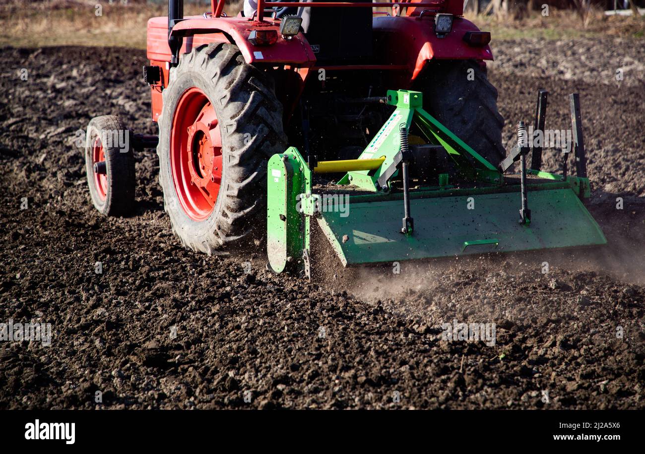 Tractor working on field hi-res stock photography and images - Alamy
