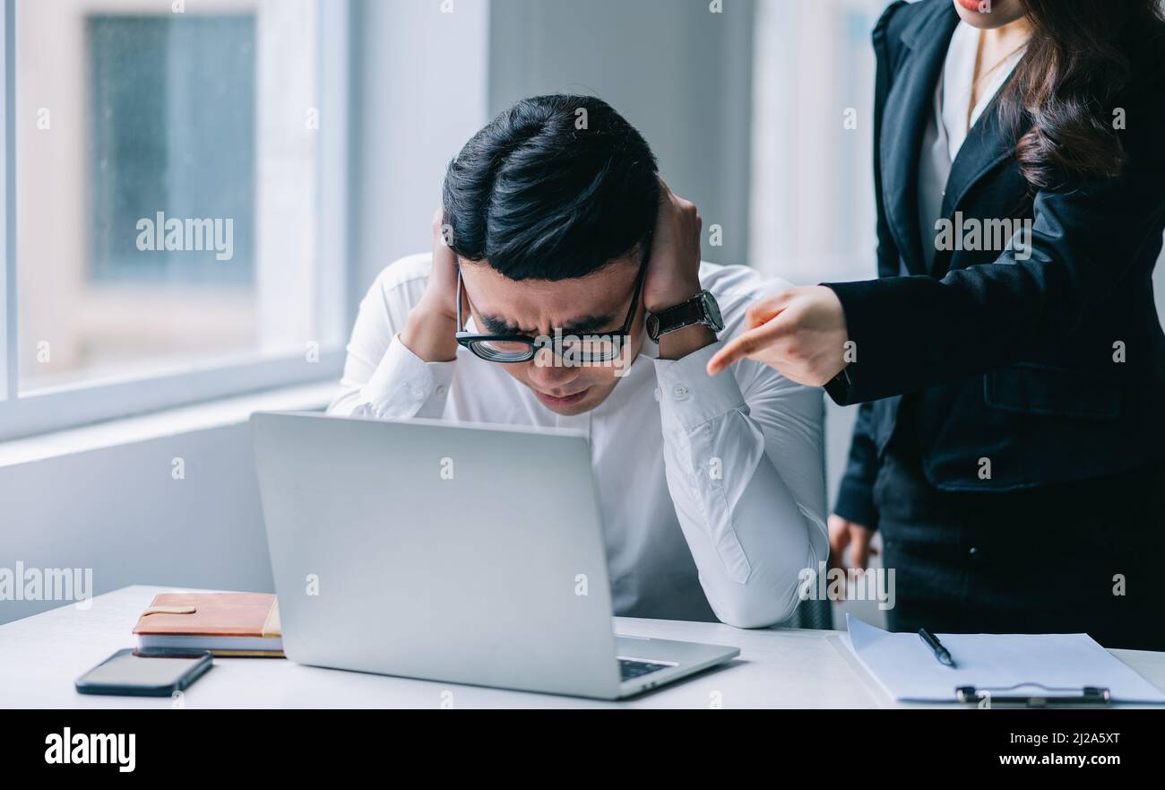 Two Asian colleagues are having a heated argument with each other Stock ...