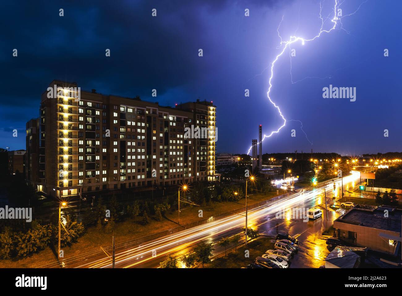 A lightning strike during a thunderstorm against the background of a ...