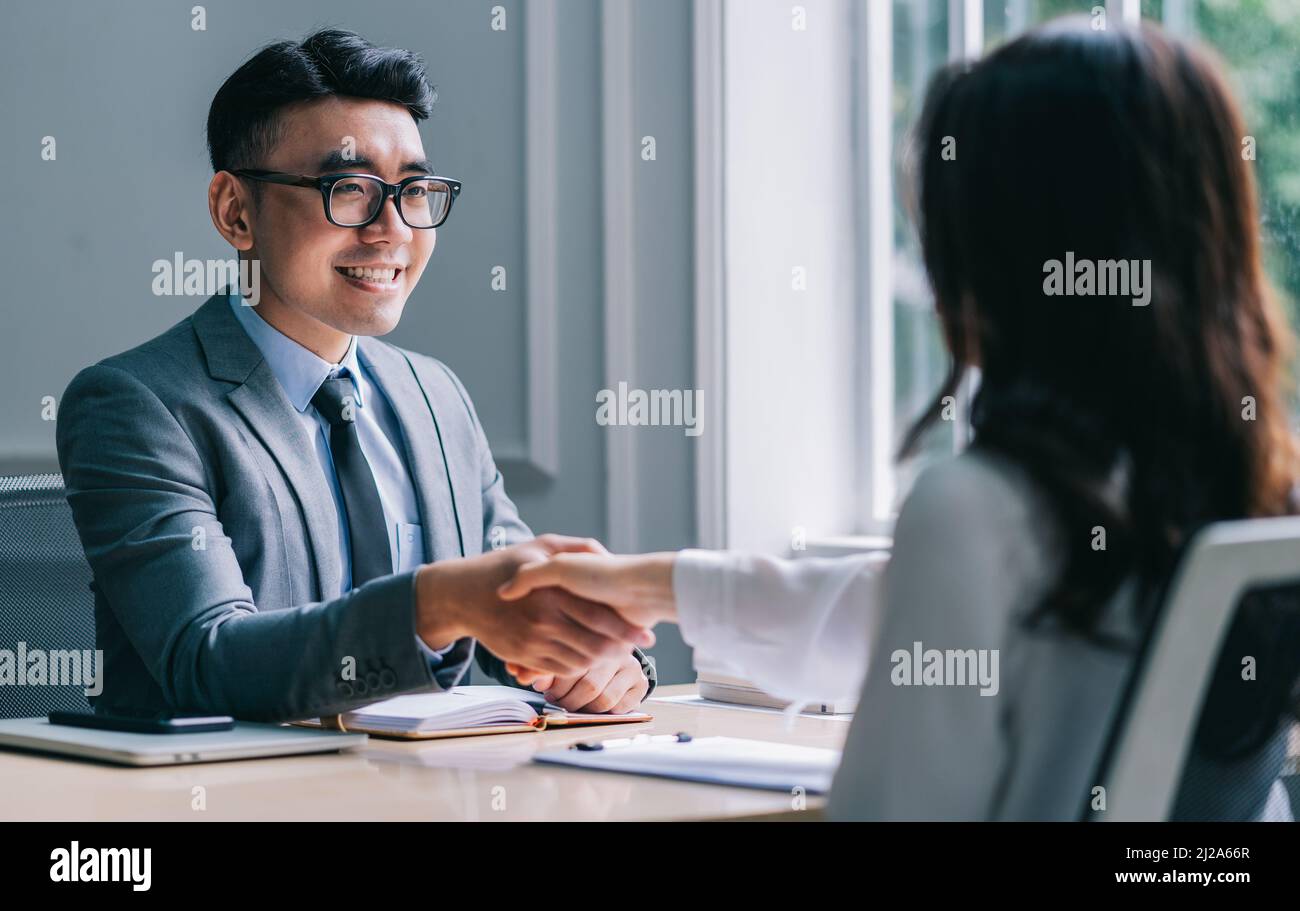Asian male director is interviewing to recruit new employees Stock ...