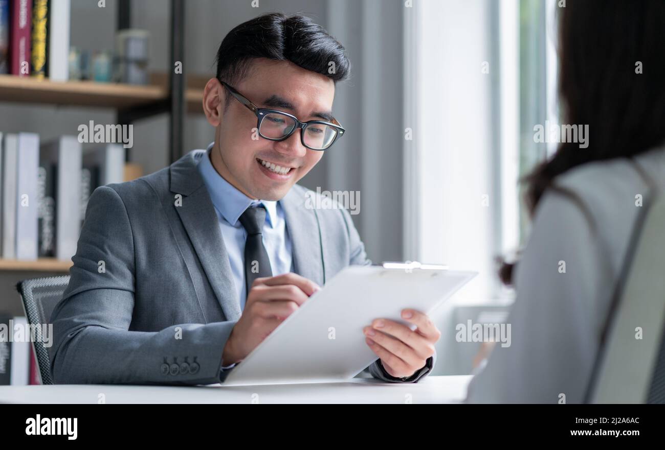 Asian male director is interviewing to recruit new employees Stock ...