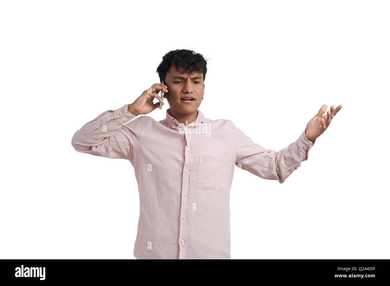 Young peruvian man angry speaking on the phone, isolated Stock Photo ...