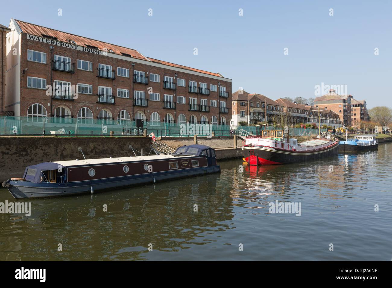 The houseboat Morgenster (red stern), a former Dutch barge, moored in ...