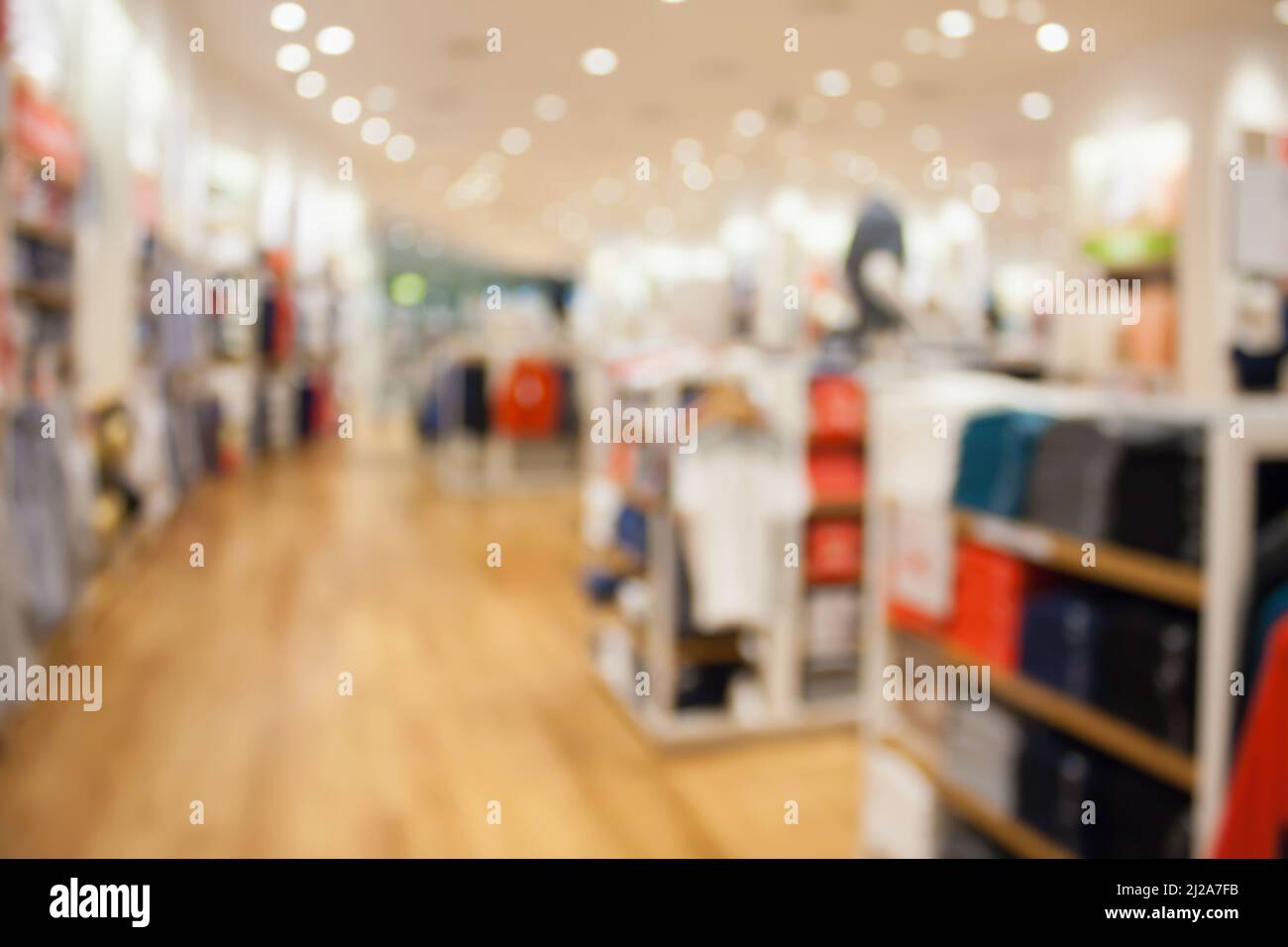 clothing boutique store interior blurred background Stock Photo - Alamy