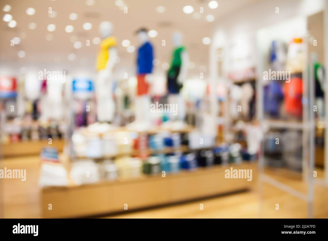clothing boutique store interior blurred background Stock Photo - Alamy