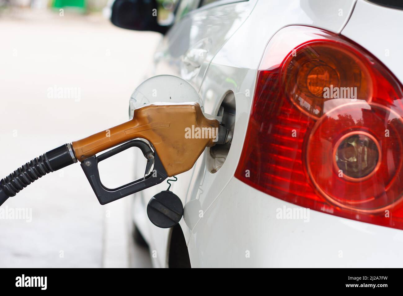 To fill the machine with fuel. Car fill with gasoline at a gas station ...