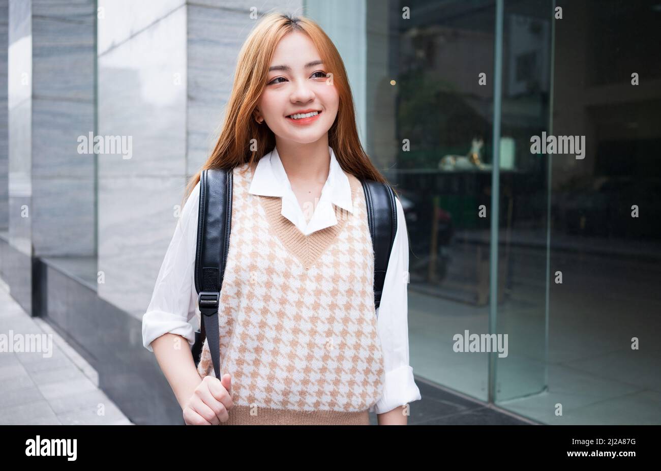 Young Asian woman going to work Stock Photo - Alamy