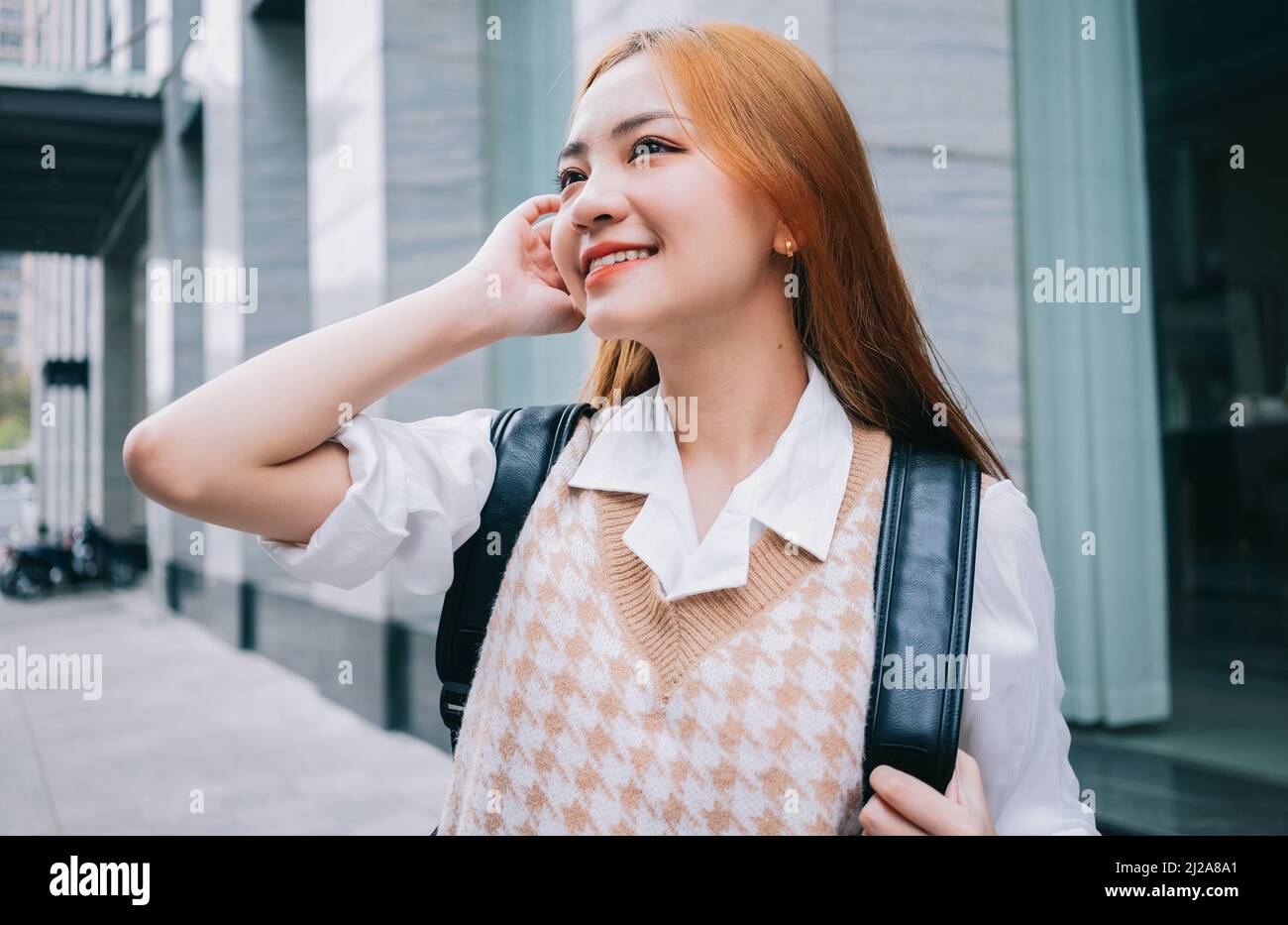 Young Asian woman going to work Stock Photo - Alamy