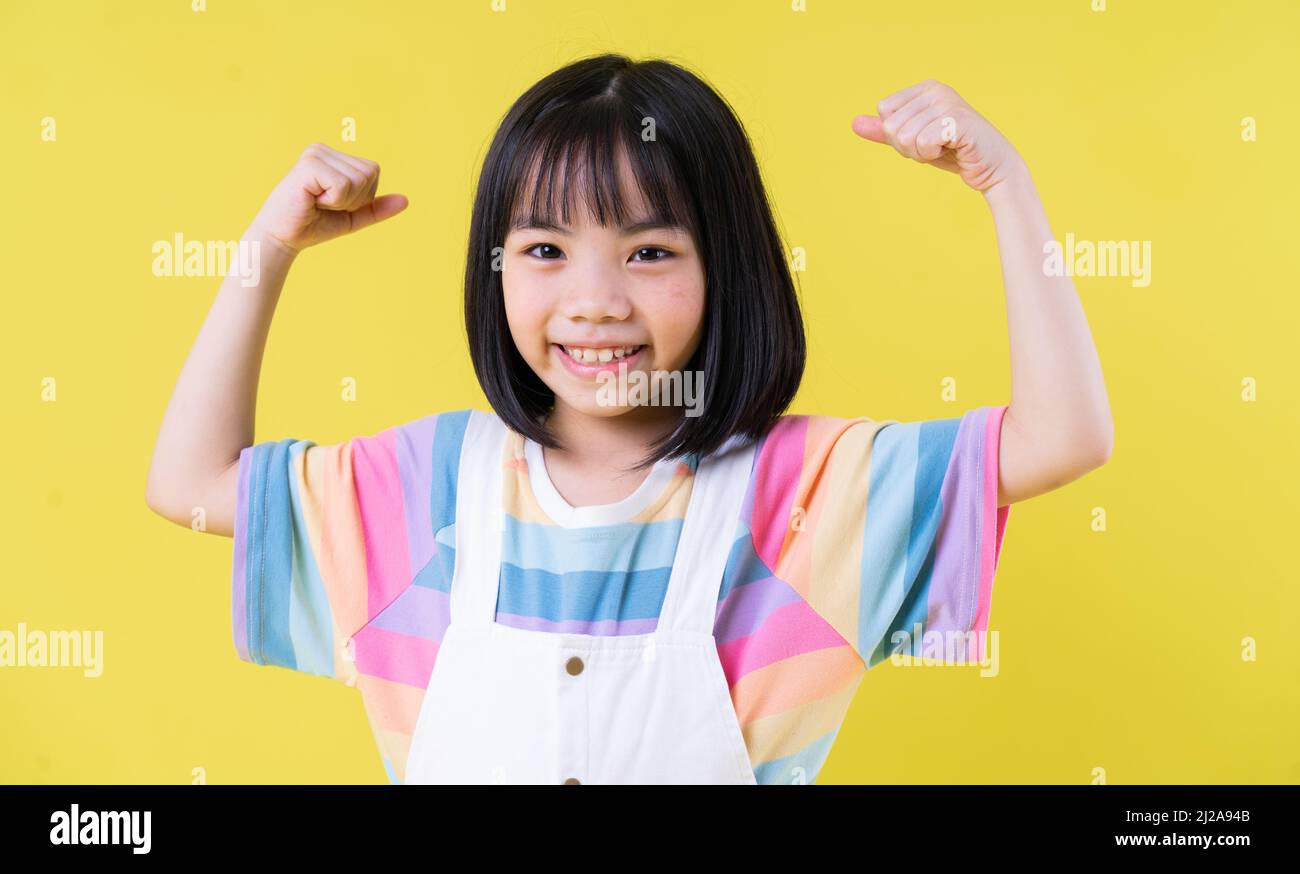 Portrait of Asian child on yellow background Stock Photo - Alamy