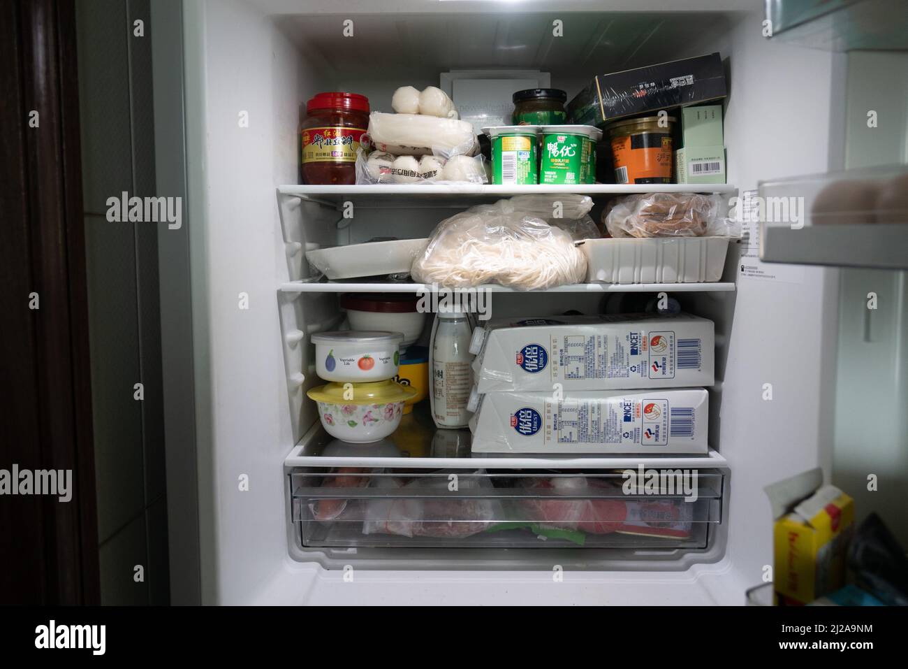 SHANGHAI, CHINA - MARCH 31, 2022 - A family's refrigerator contains ...