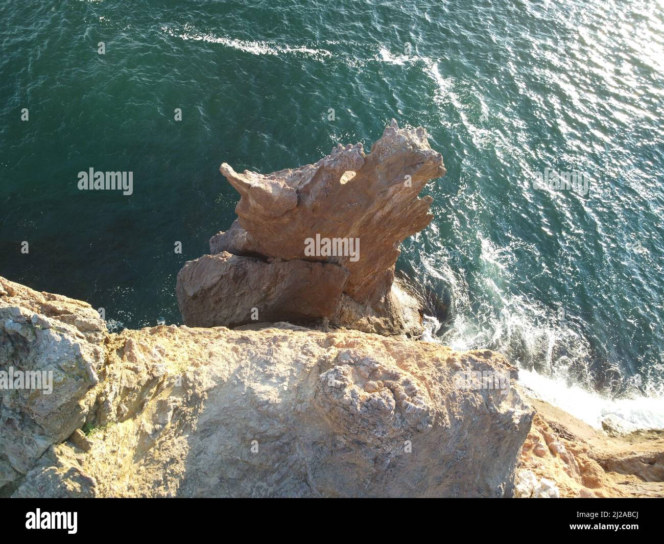 Dragon head arise from the water - The rock or lava formation with the ...
