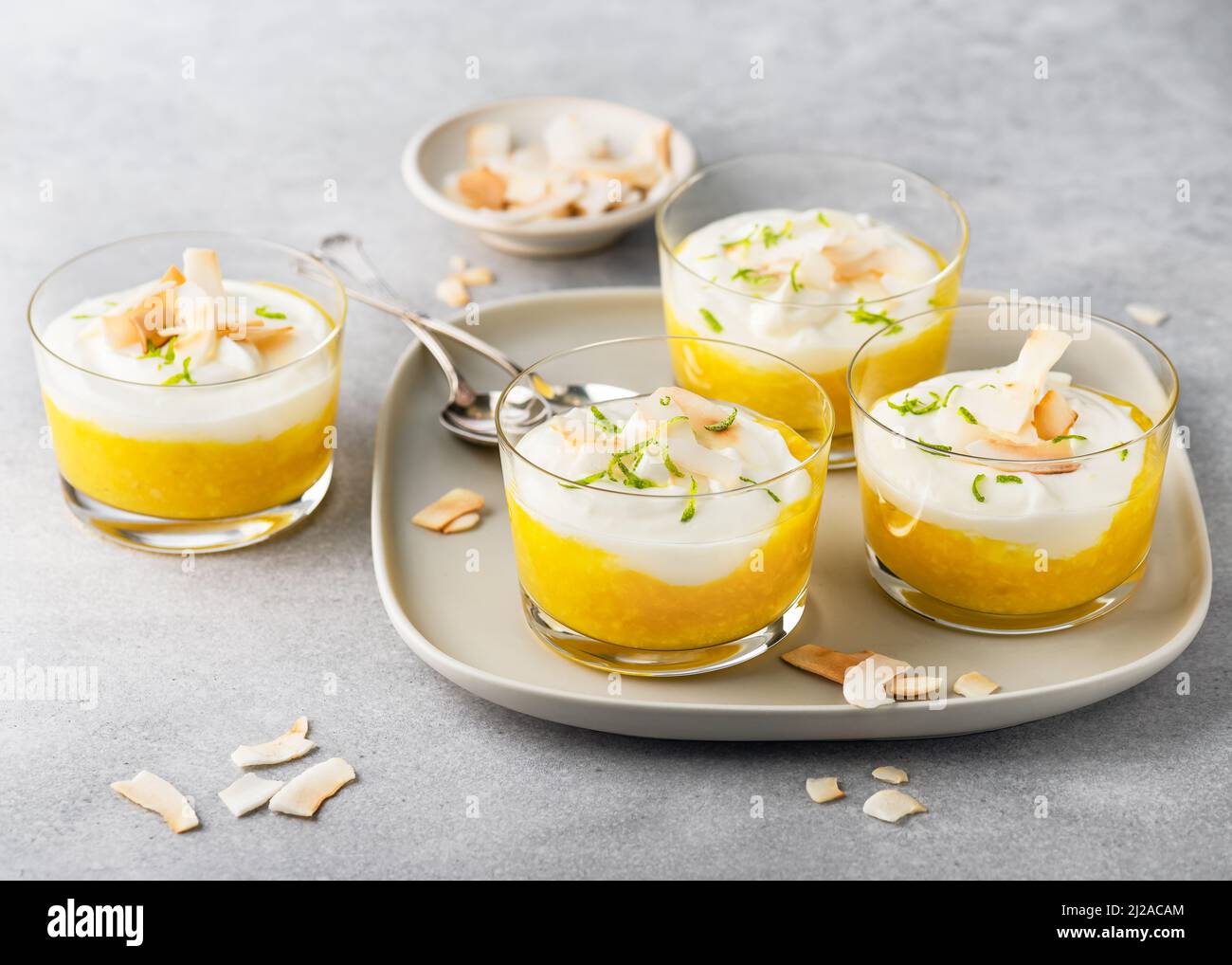 Homemade delicious mango puree and cream cheese layered dessert ...