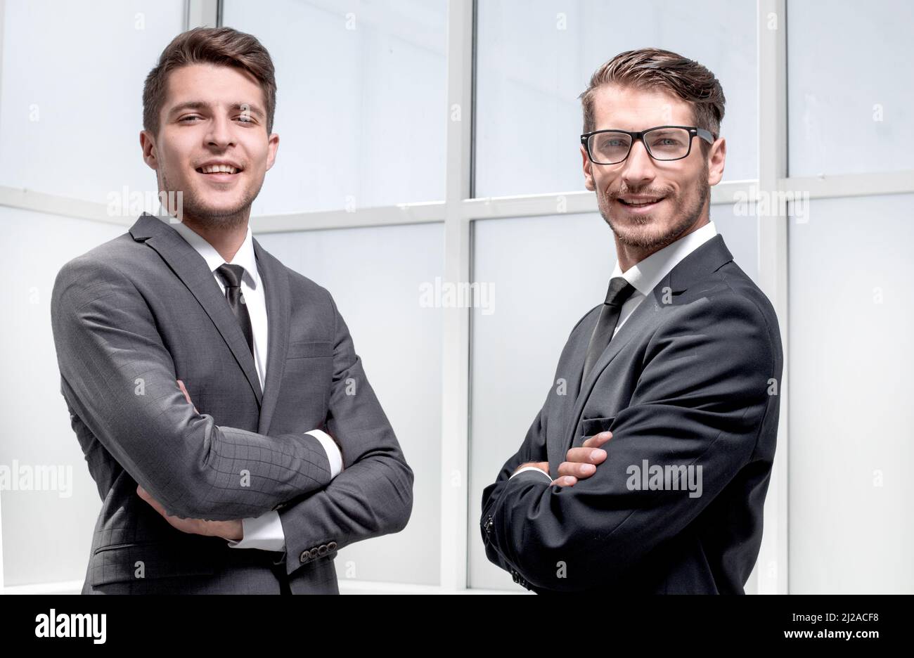 two businessmen posing Stock Photo - Alamy